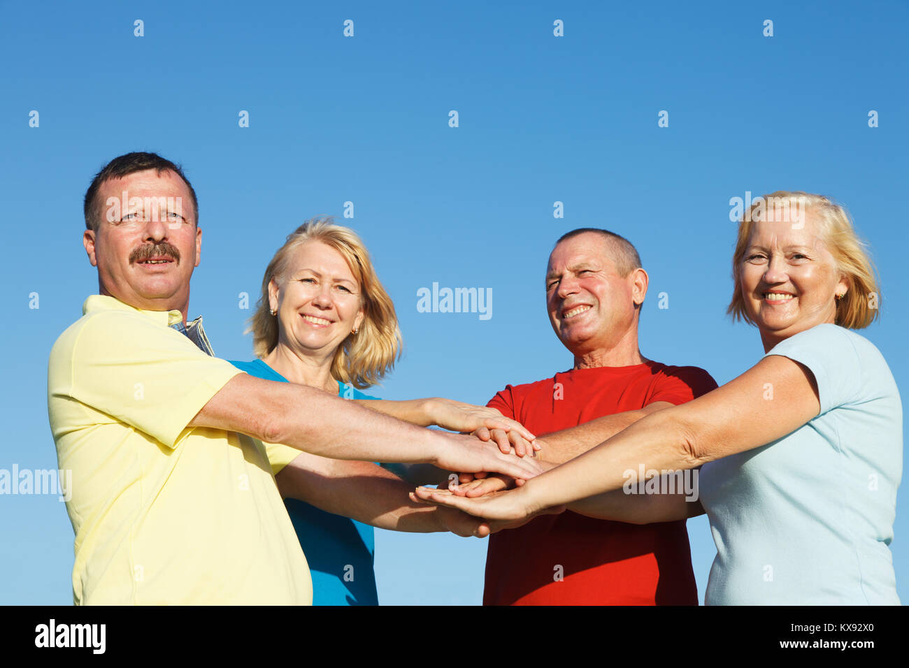 Group of happy people smiling and show unity Stock Photo - Alamy