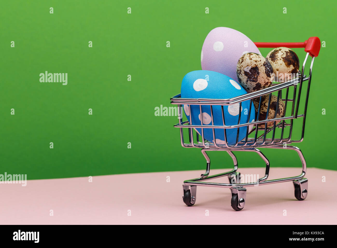 Multicolored easter eggs in a trolley with space for text Stock Photo ...