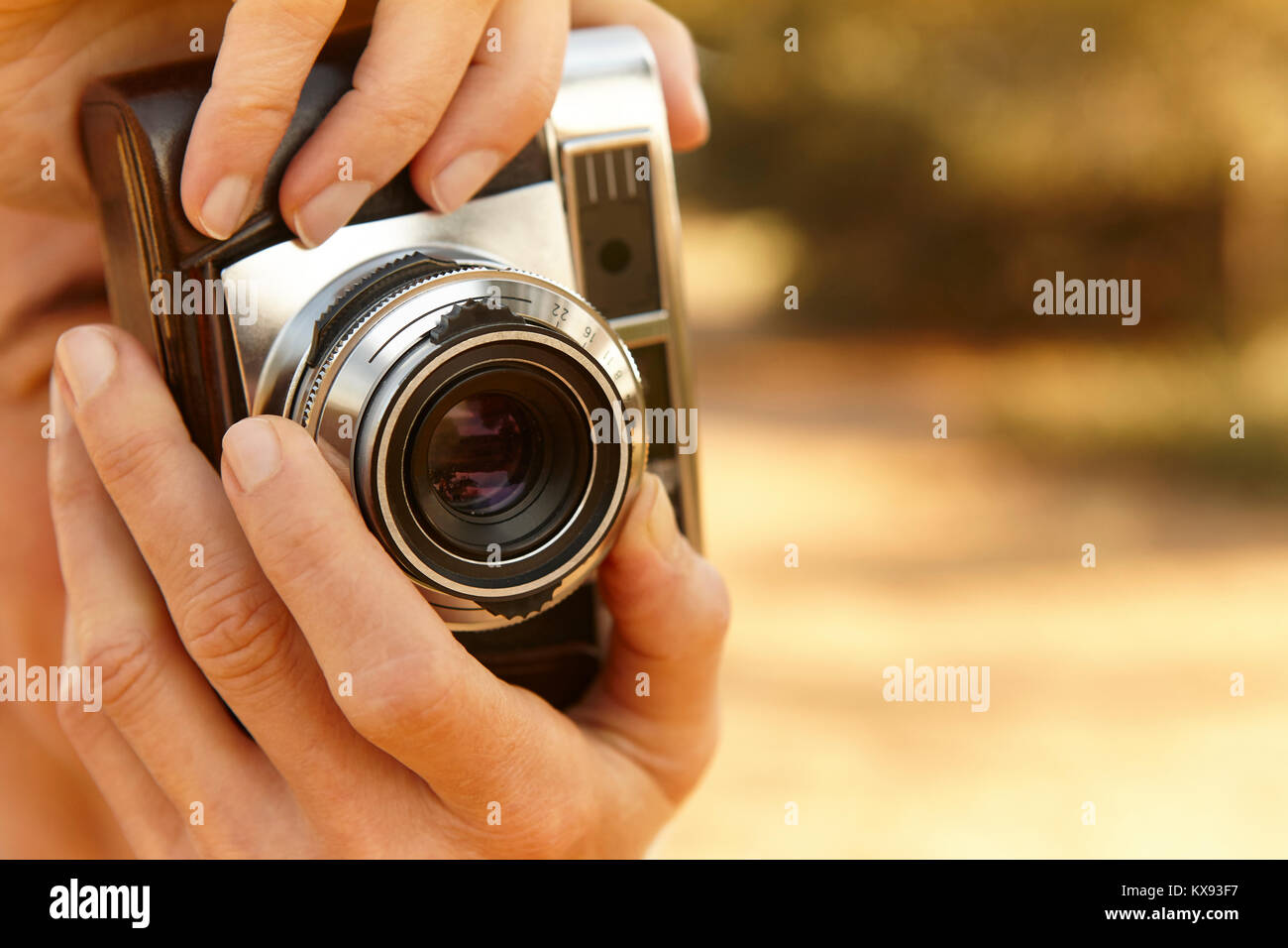 Woman taking pictures with vintage camera. Travel background Stock ...