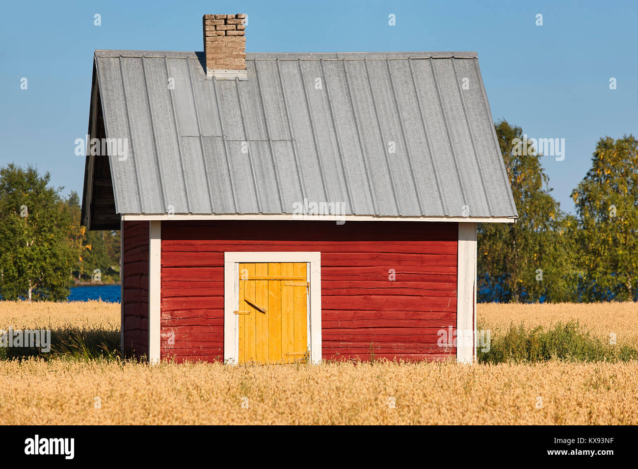 Traditional finnish red wooden farm in the countryside. Finland Stock ...