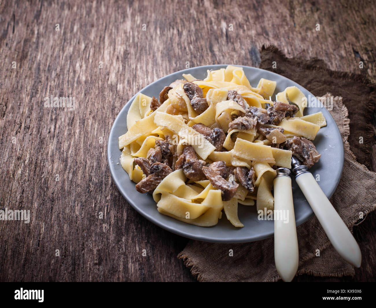Pasta tagliatelle with mushrooms Stock Photo - Alamy