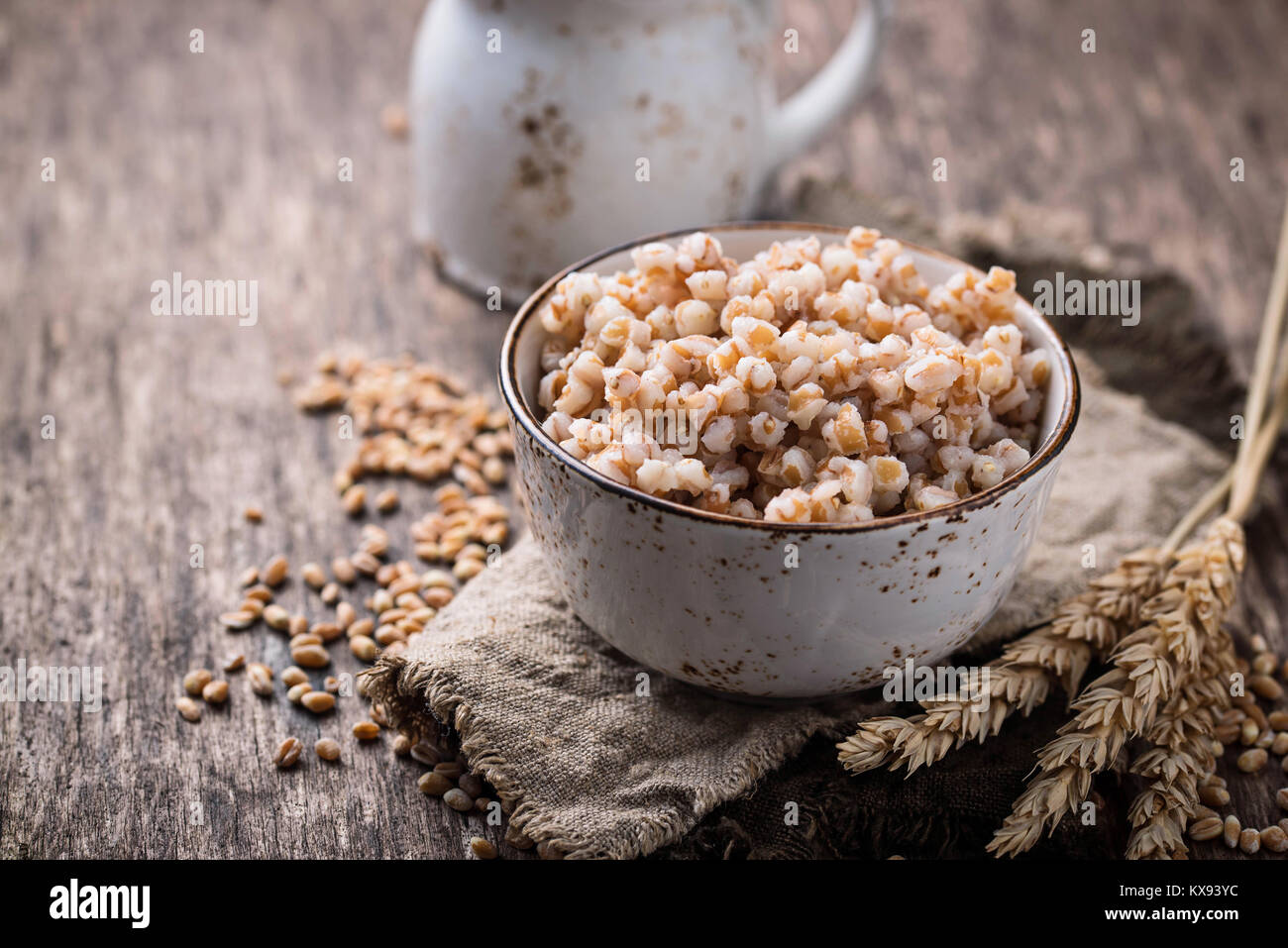 Bowl of barley porridge on wooden background Stock Photo - Alamy