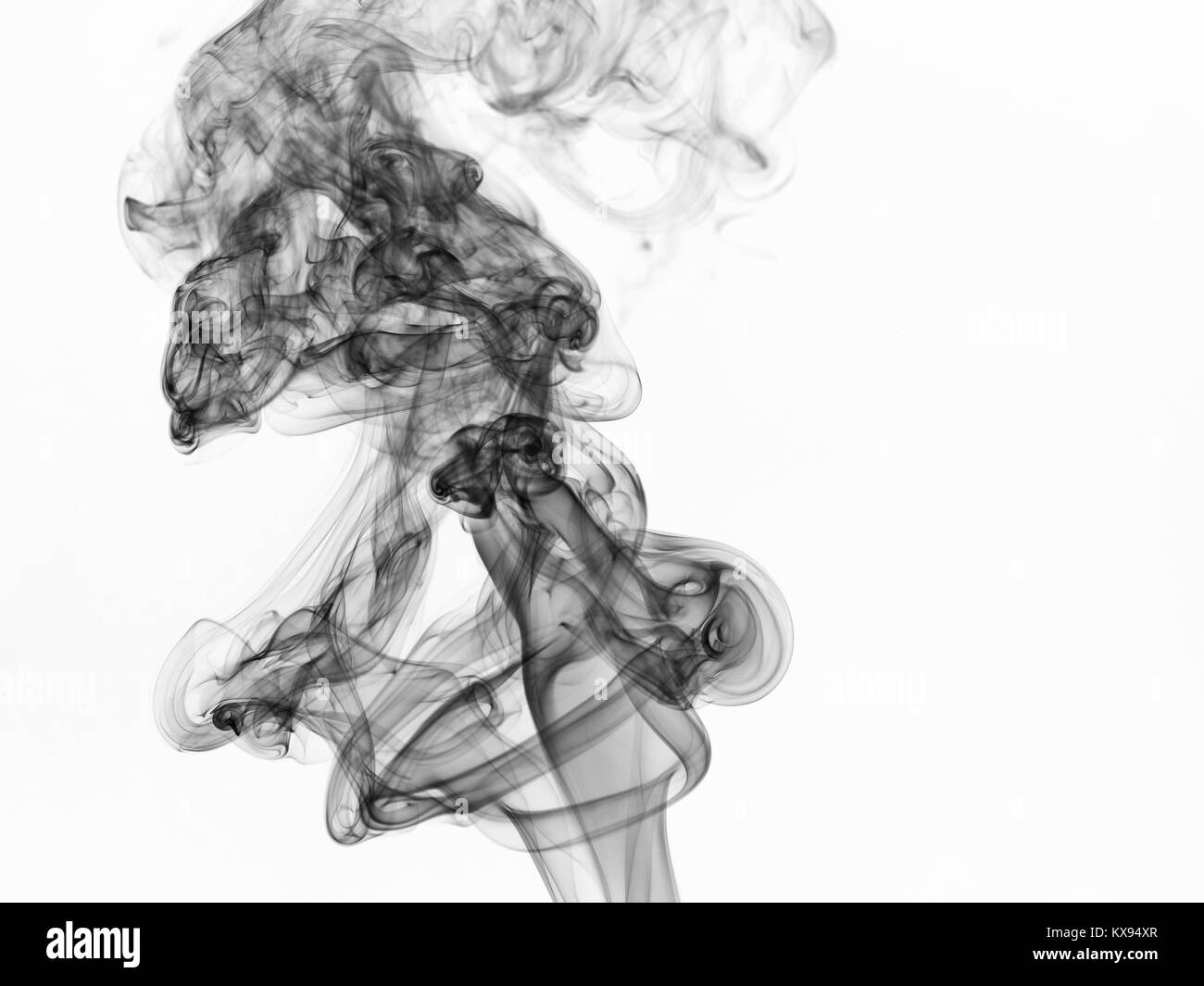 A whisp of black smoke against the white background Stock Photo - Alamy