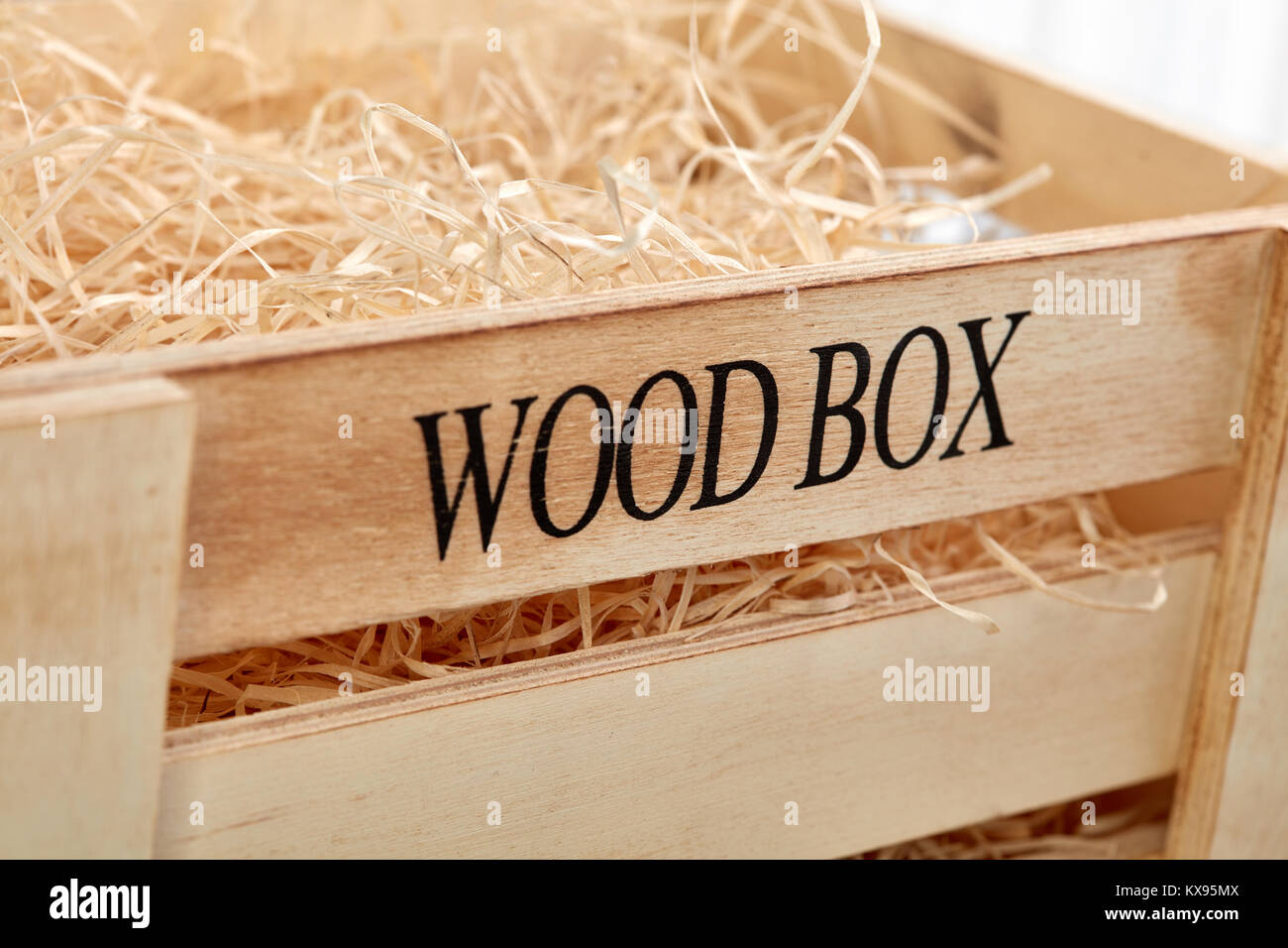 Wooden box with straw Stock Photo - Alamy