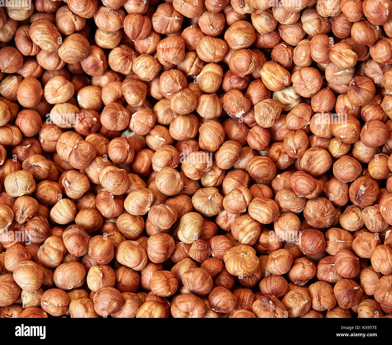 Hazelnut Background. Heap of peeled hazelnuts Stock Photo - Alamy