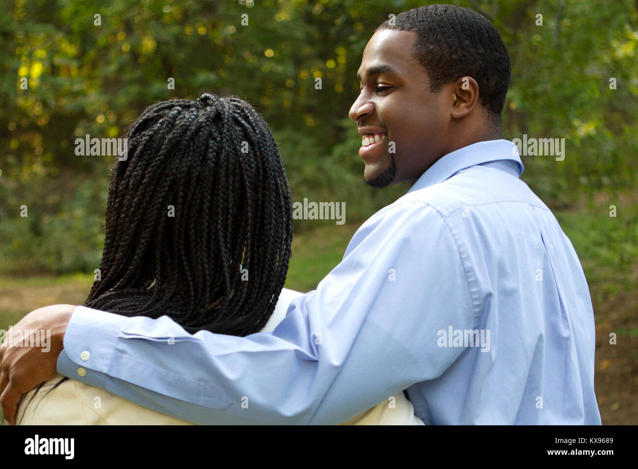 Beautiful happy couple smiling outside Stock Photo - Alamy