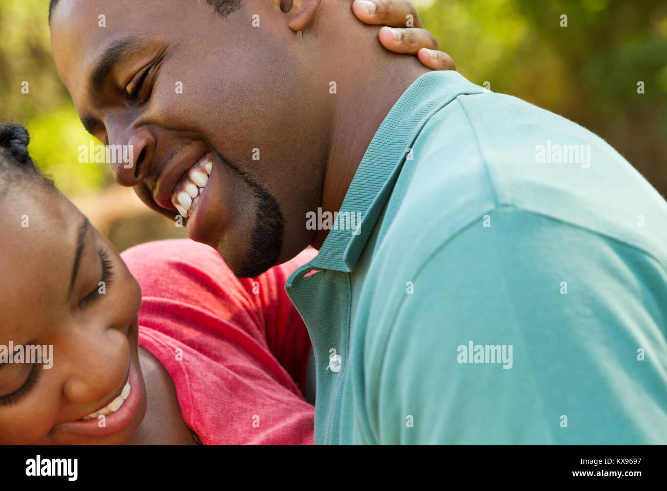 Beautiful happy couple smiling outside Stock Photo - Alamy