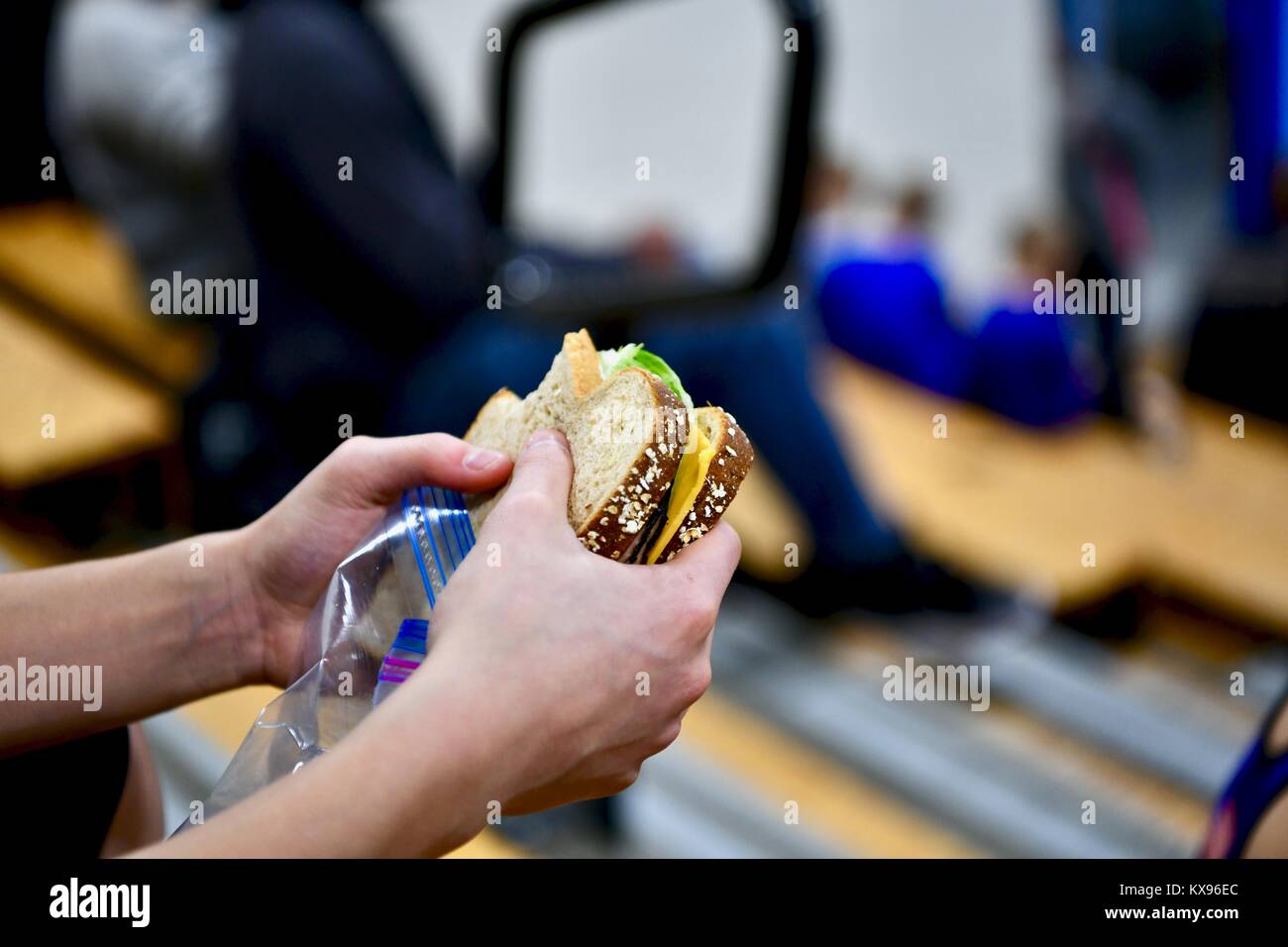 Holding a sandwich in hands Stock Photo - Alamy