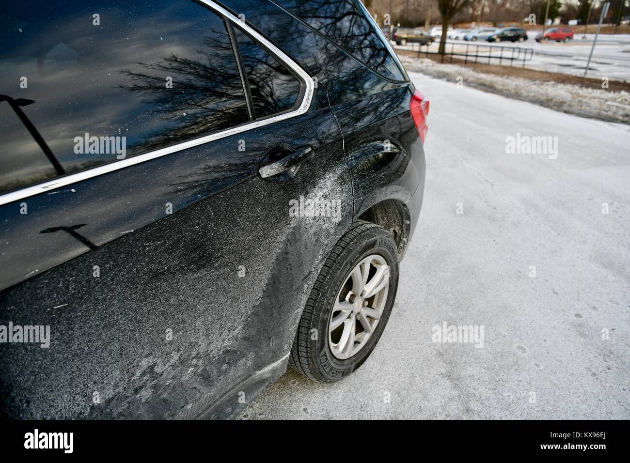 Black Chevy car covered with salt from recent snow storm preperations ...