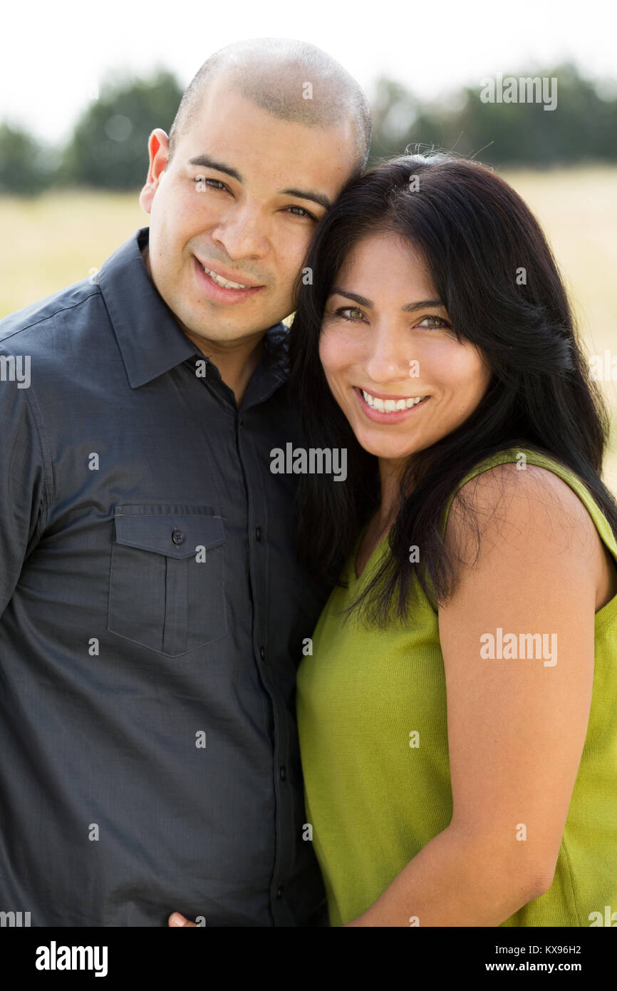 Young Hispanic couple smiling Stock Photo - Alamy