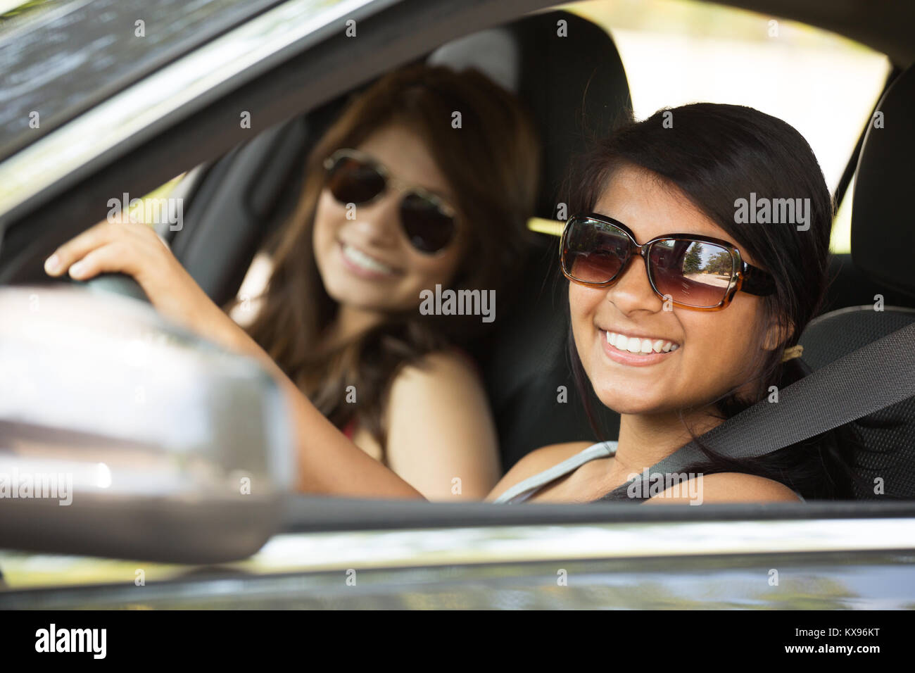 Friends driving taking a road trip Stock Photo - Alamy