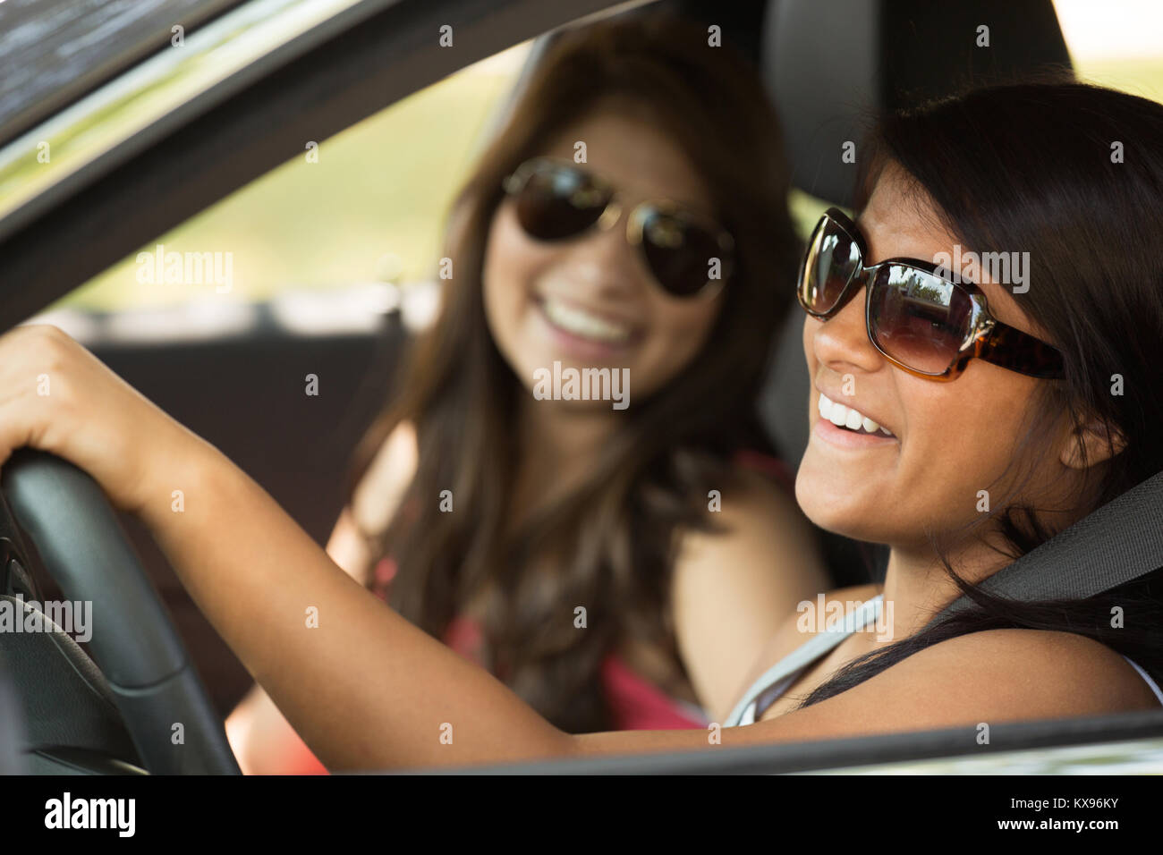 Friends driving taking a road trip Stock Photo - Alamy