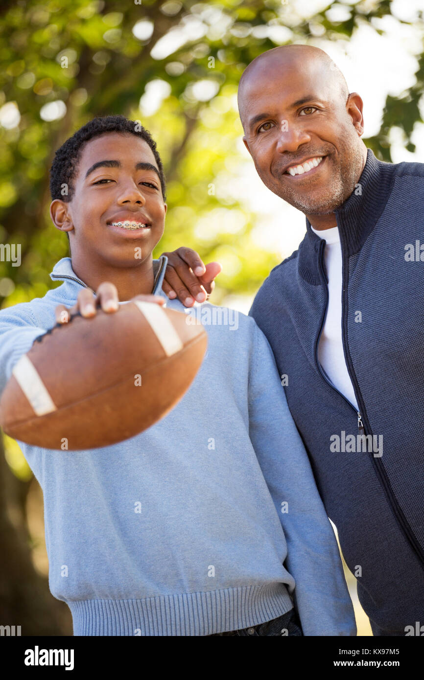 Father and son playing football Stock Photo - Alamy