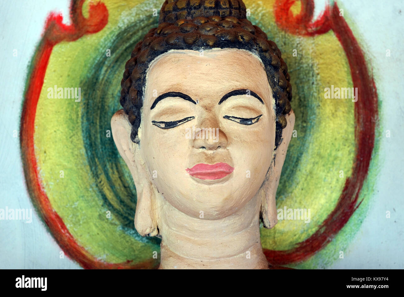 Head of Buddha and wall in monastery Stock Photo - Alamy