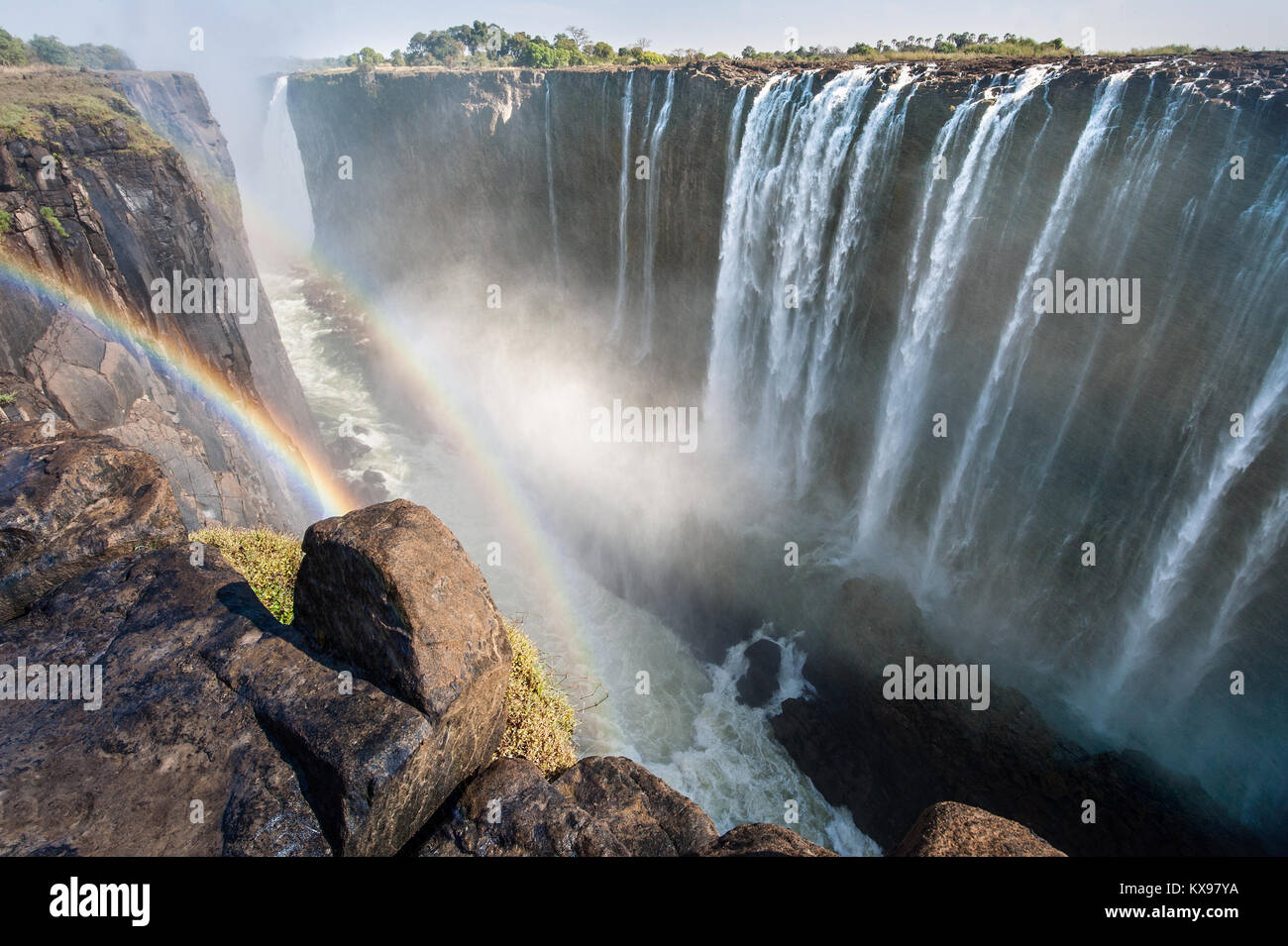 Rainbow over Victoria Falls on Zambezi River, border of Zambia and ...