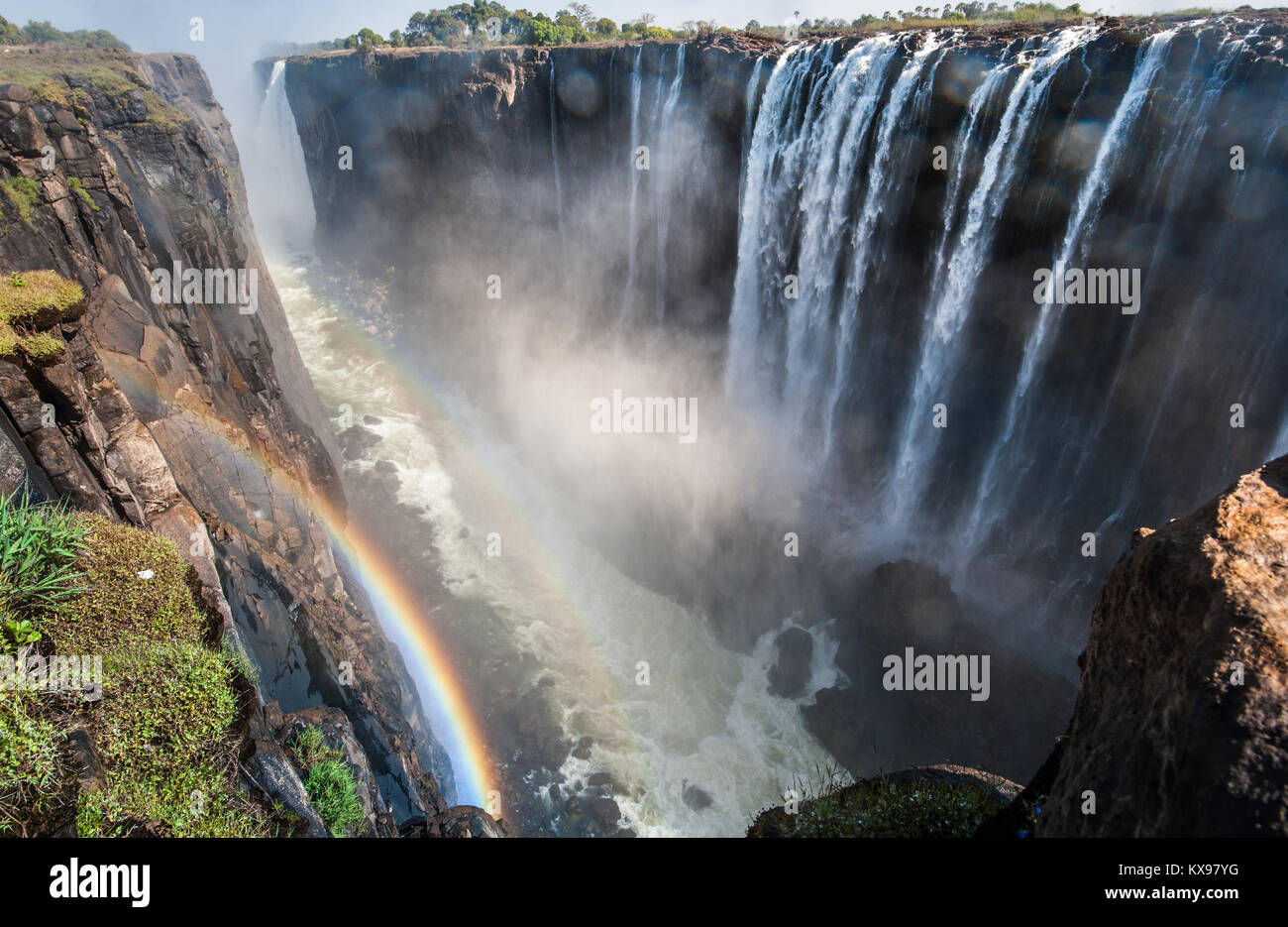Rainbow over Victoria Falls on Zambezi River, border of Zambia and ...