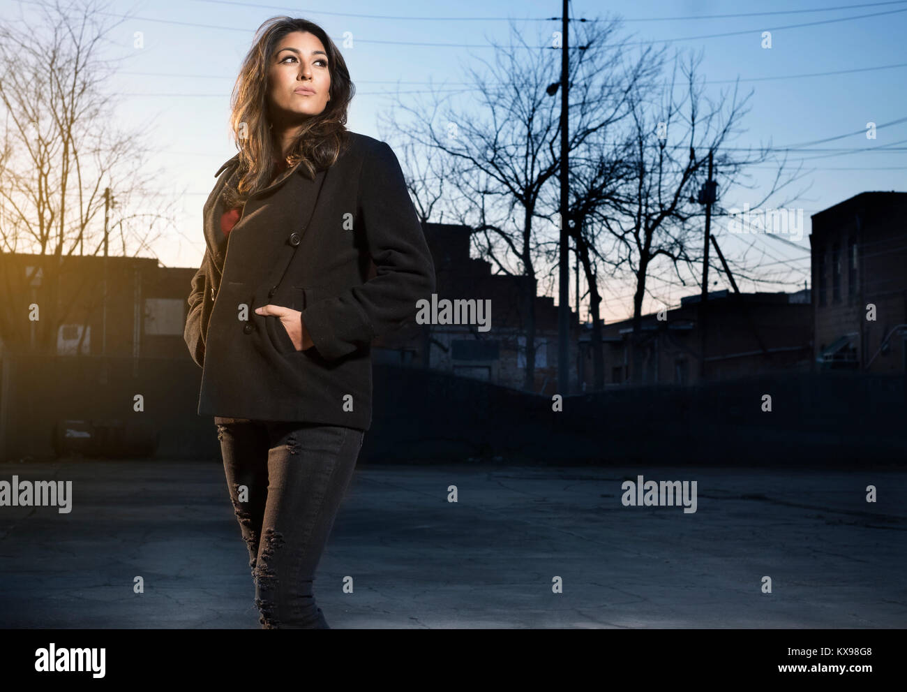 Young trendy woman in urban setting Stock Photo - Alamy