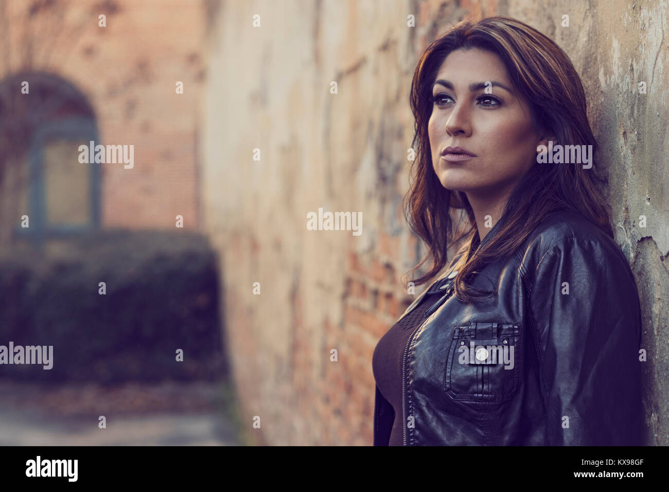 Young trendy woman in urban setting Stock Photo - Alamy