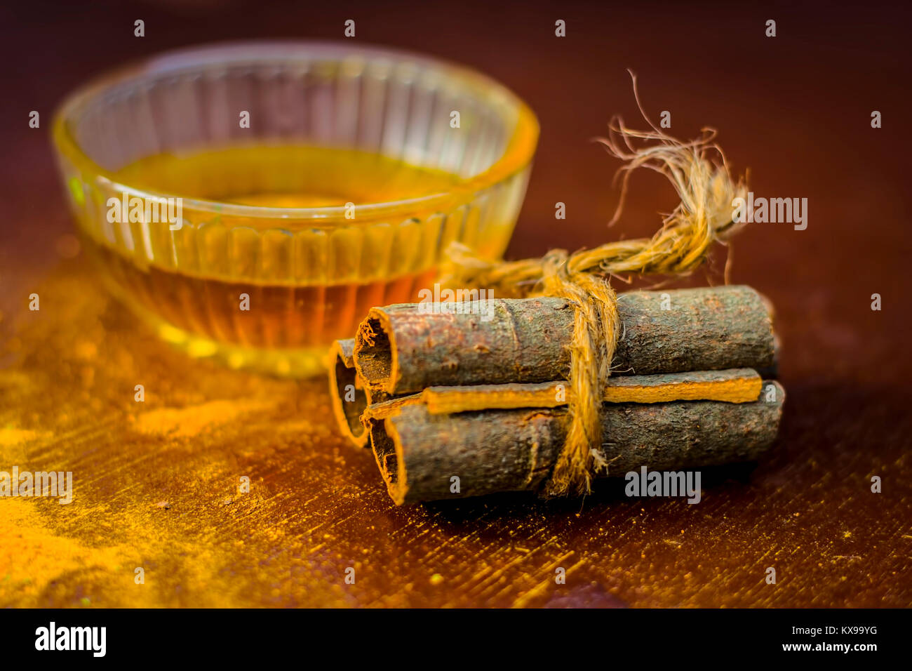Water of cinnamon,Cinnamomum zeylanicum in a glass bowl on wooden ...