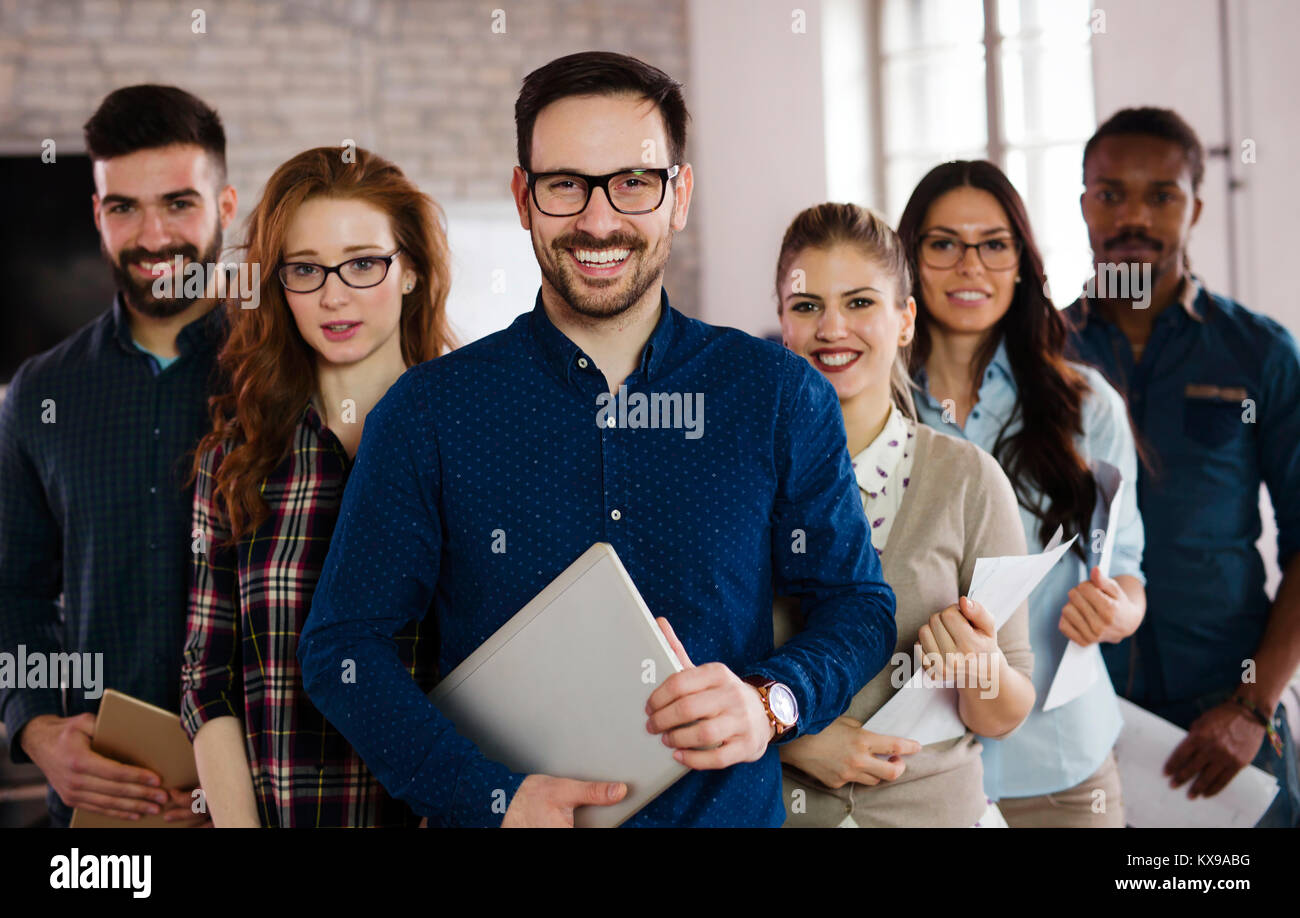 Group picture of team of successful and confident designers Stock Photo ...