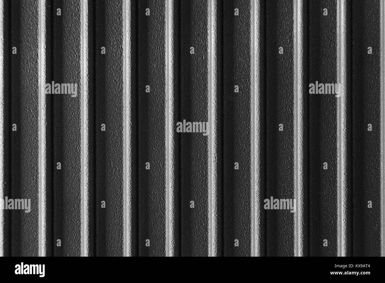 ribbed cast iron surface, metal texture, textured black background ...