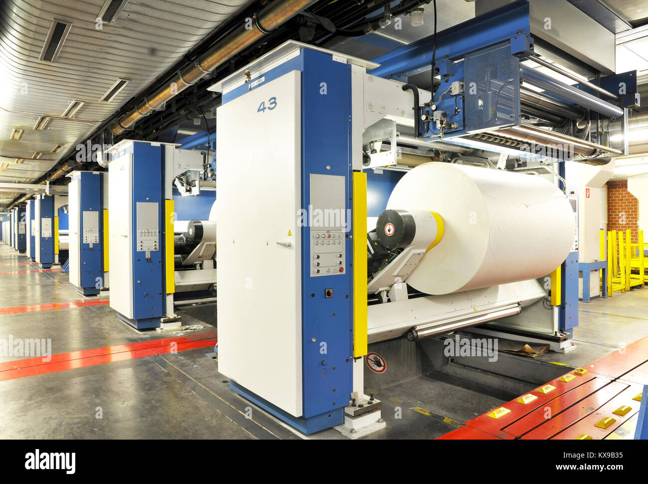 Paper rolls in a printing machine of a large print shop Stock Photo - Alamy