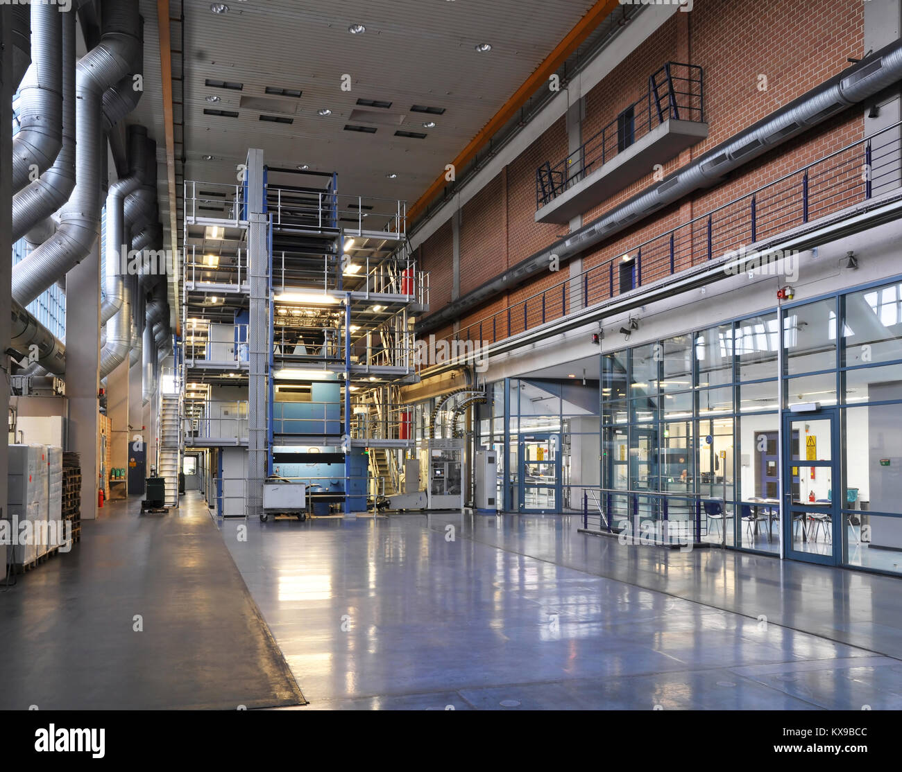 factory hall with a large offset printing press in a printing plant for ...