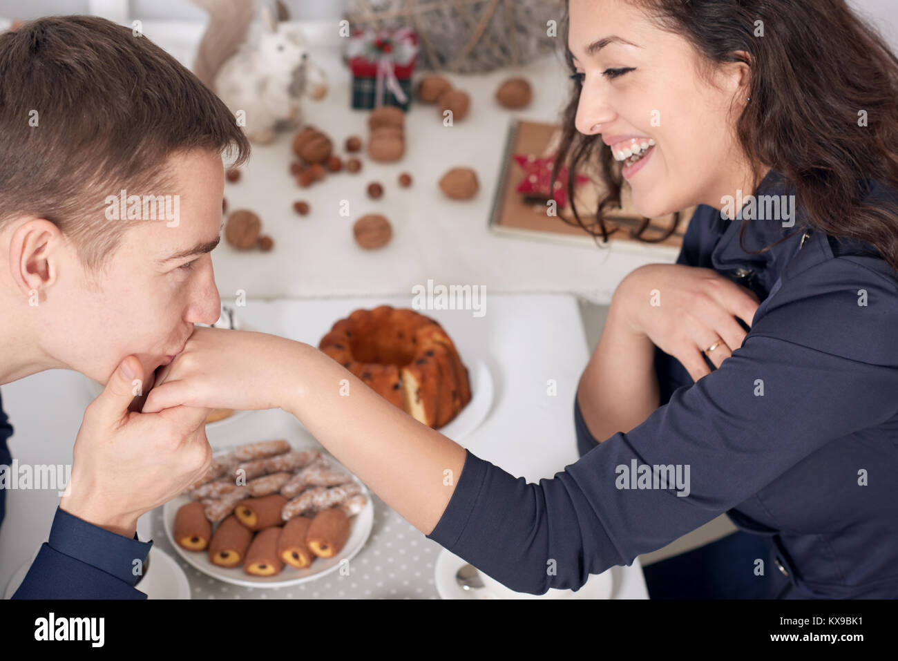 happy couple kissing and drinking tea indoor Stock Photo - Alamy