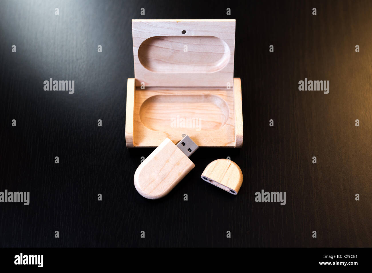 wooden usb flash drive on a black table Stock Photo - Alamy