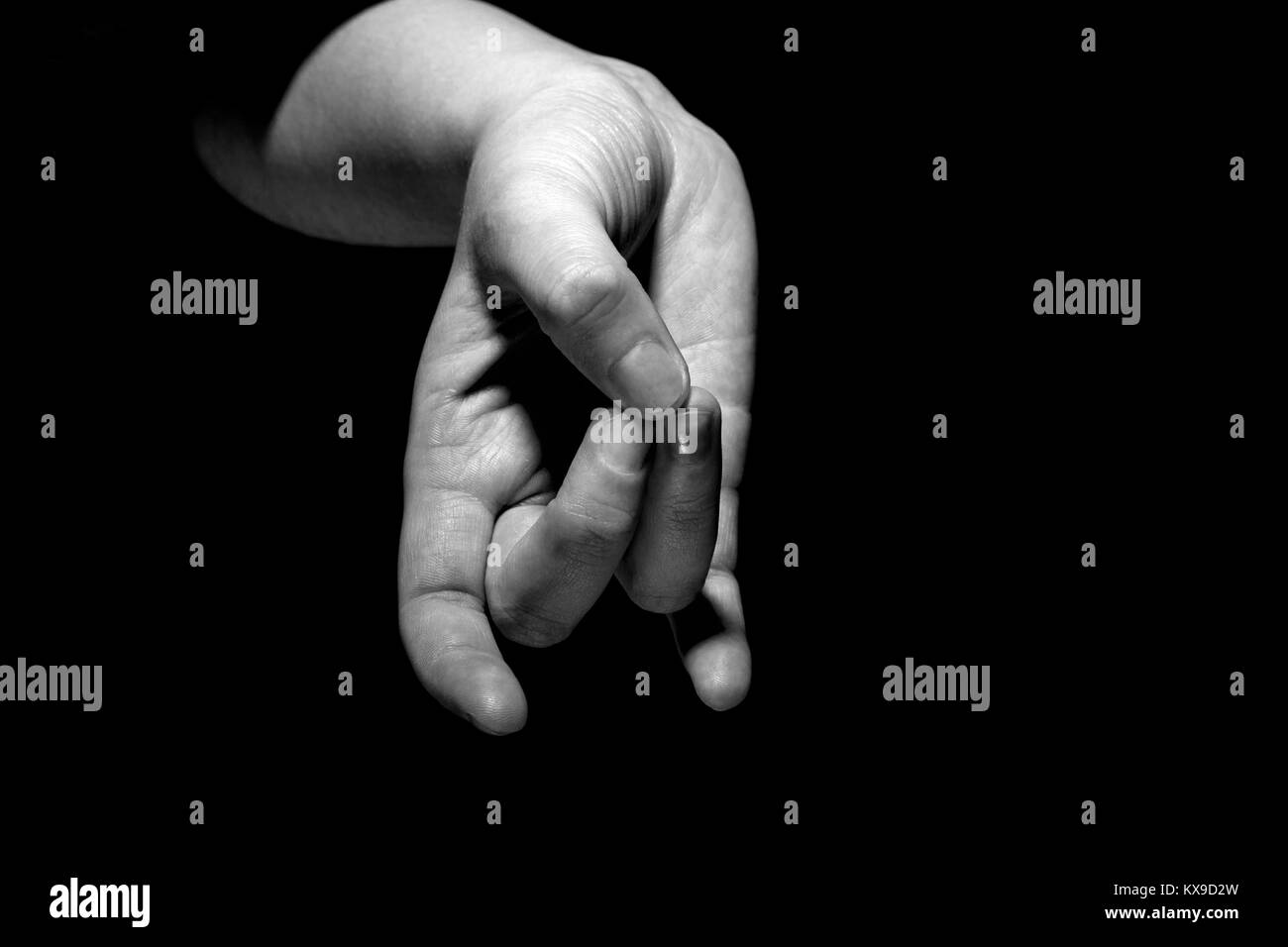 hand in mudra gesture on black background, monochrome Stock Photo - Alamy