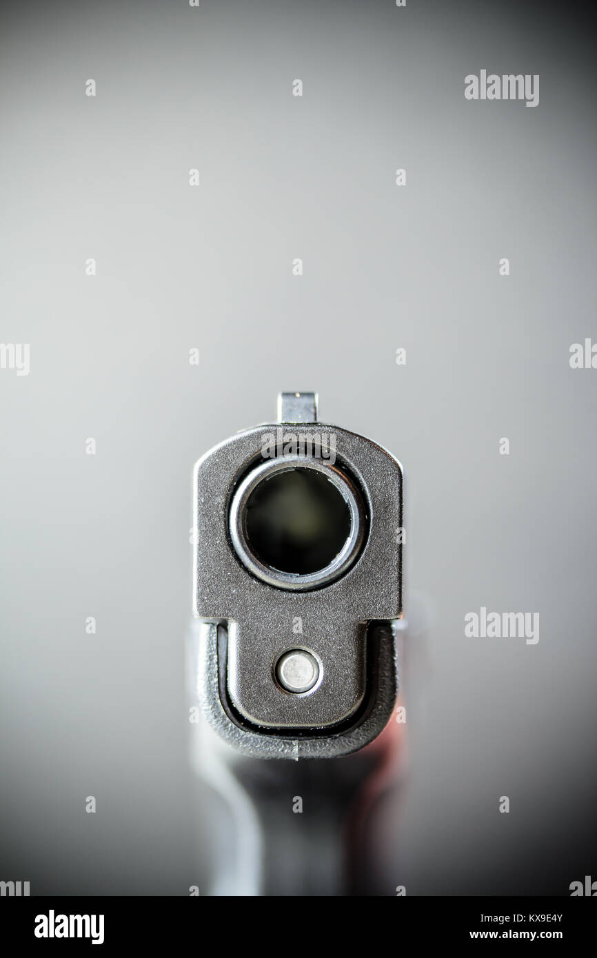 A black pistol hand gun pointed at the viewer Stock Photo - Alamy