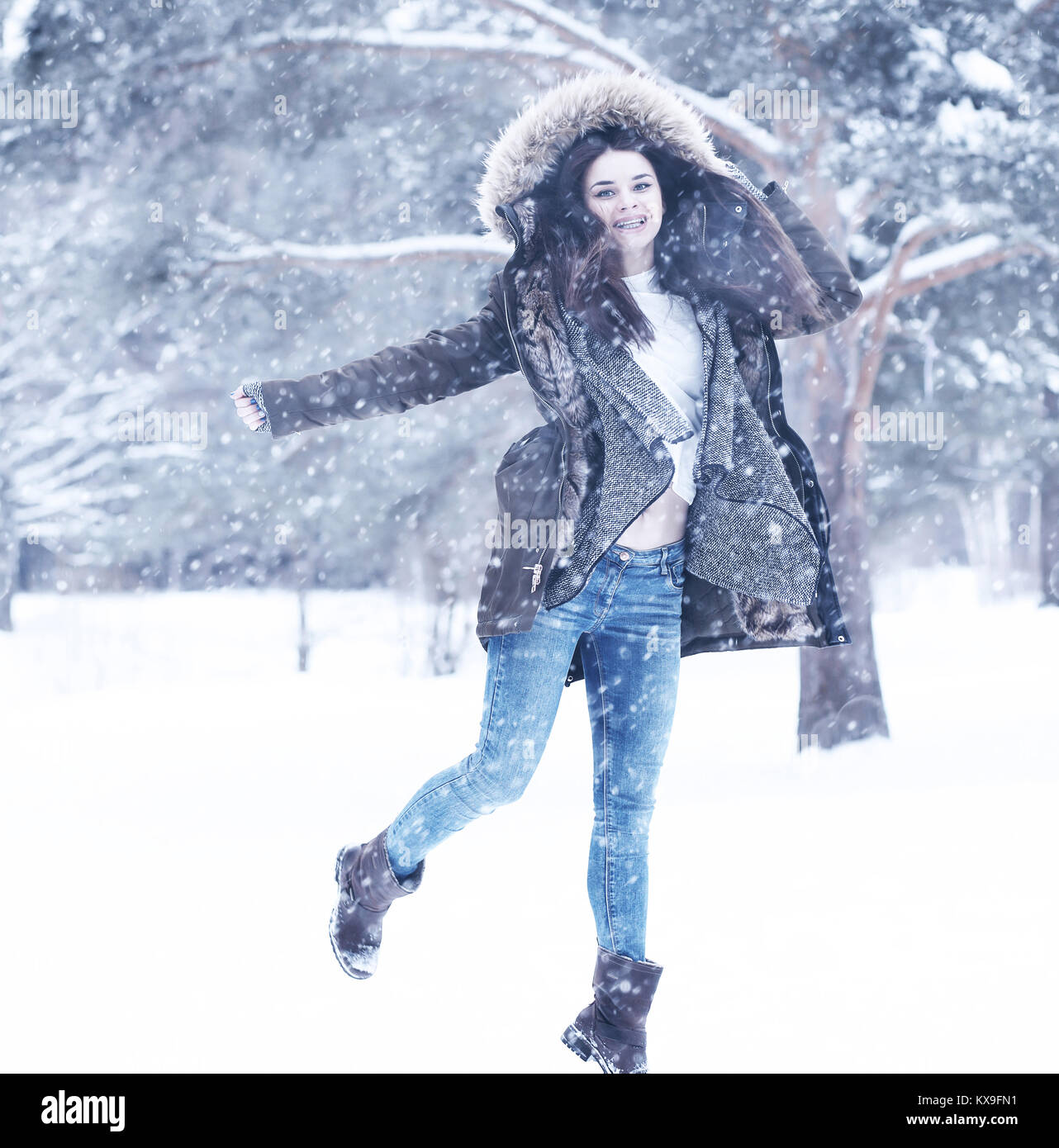 Beautiful girl in a beautiful winter snow Stock Photo - Alamy