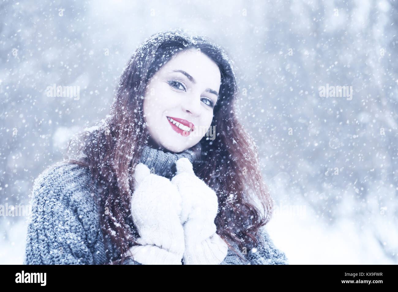 Beautiful girl in a beautiful winter snow Stock Photo - Alamy