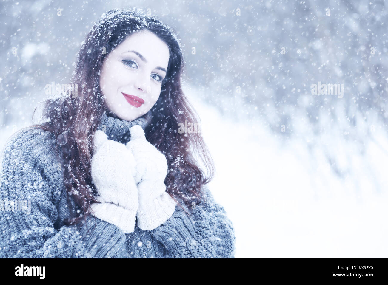 Beautiful girl in a beautiful winter snow Stock Photo - Alamy