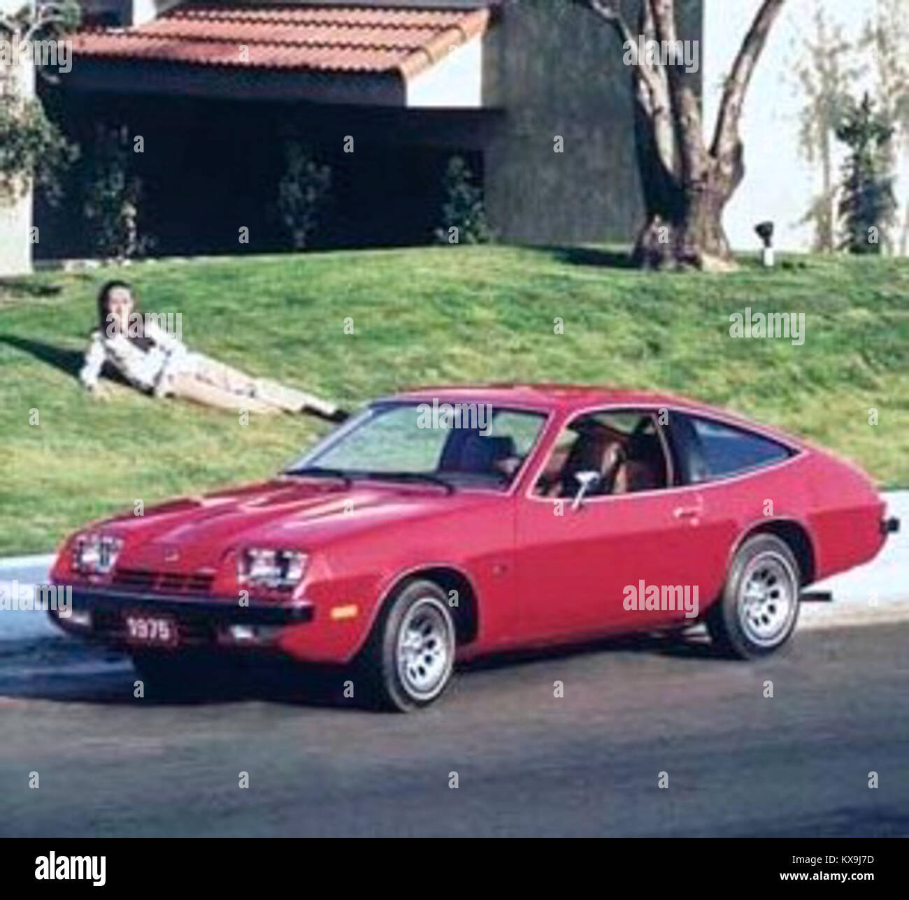 This image features a 1975 Chevrolet Monza 2+2, a classic American ...