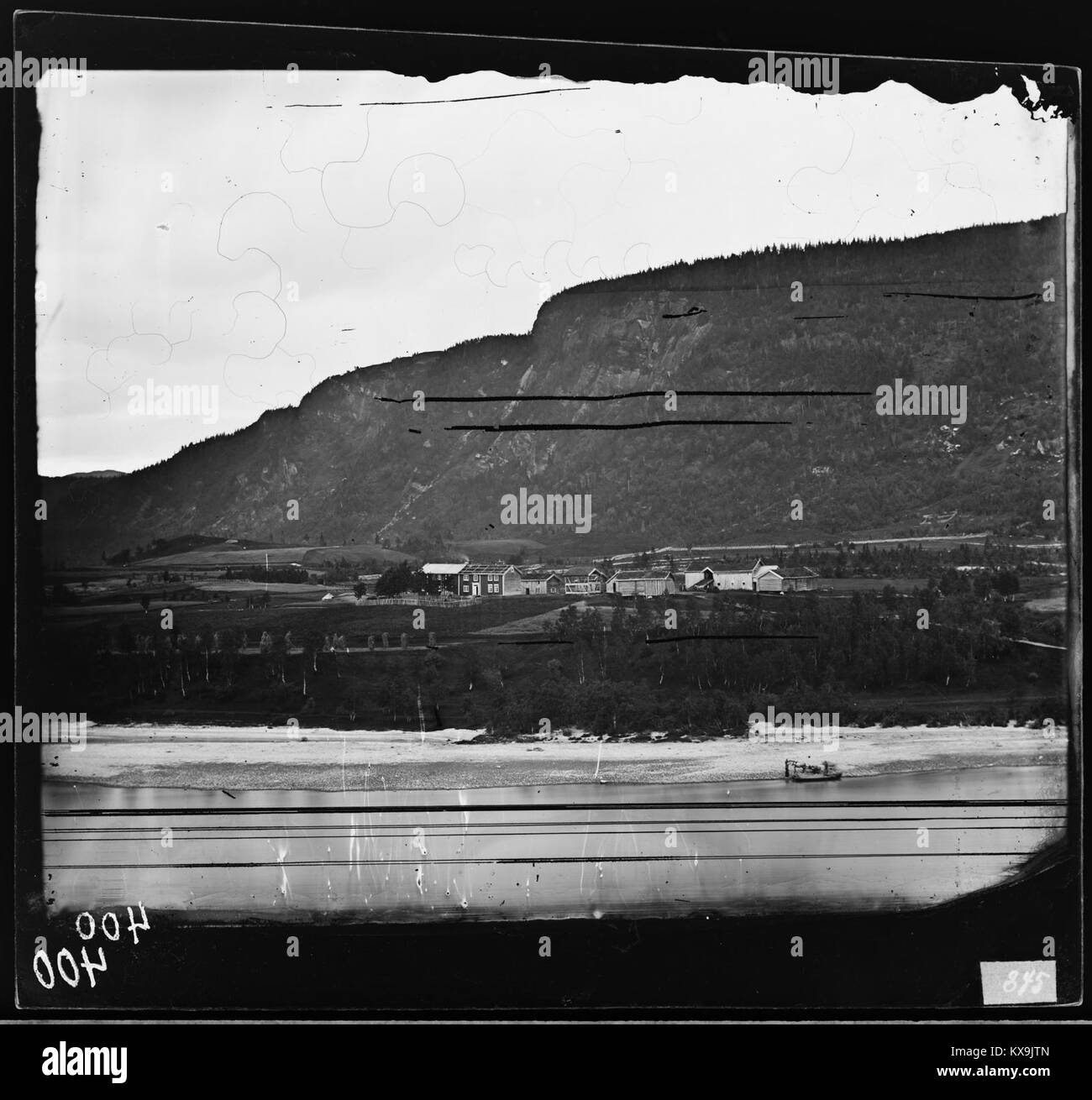 The photograph shows Lensmand Olsen’s farm with the ferry in the ...