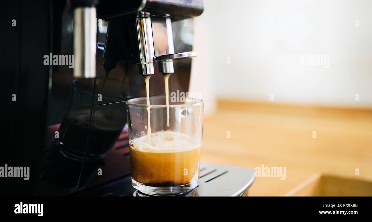 Coffee machine making coffee in morning with crema Stock Photo - Alamy