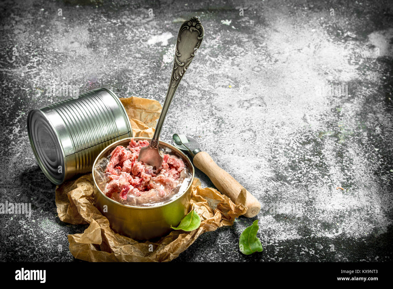 Canned meat in a tin can. On a rustic background Stock Photo - Alamy