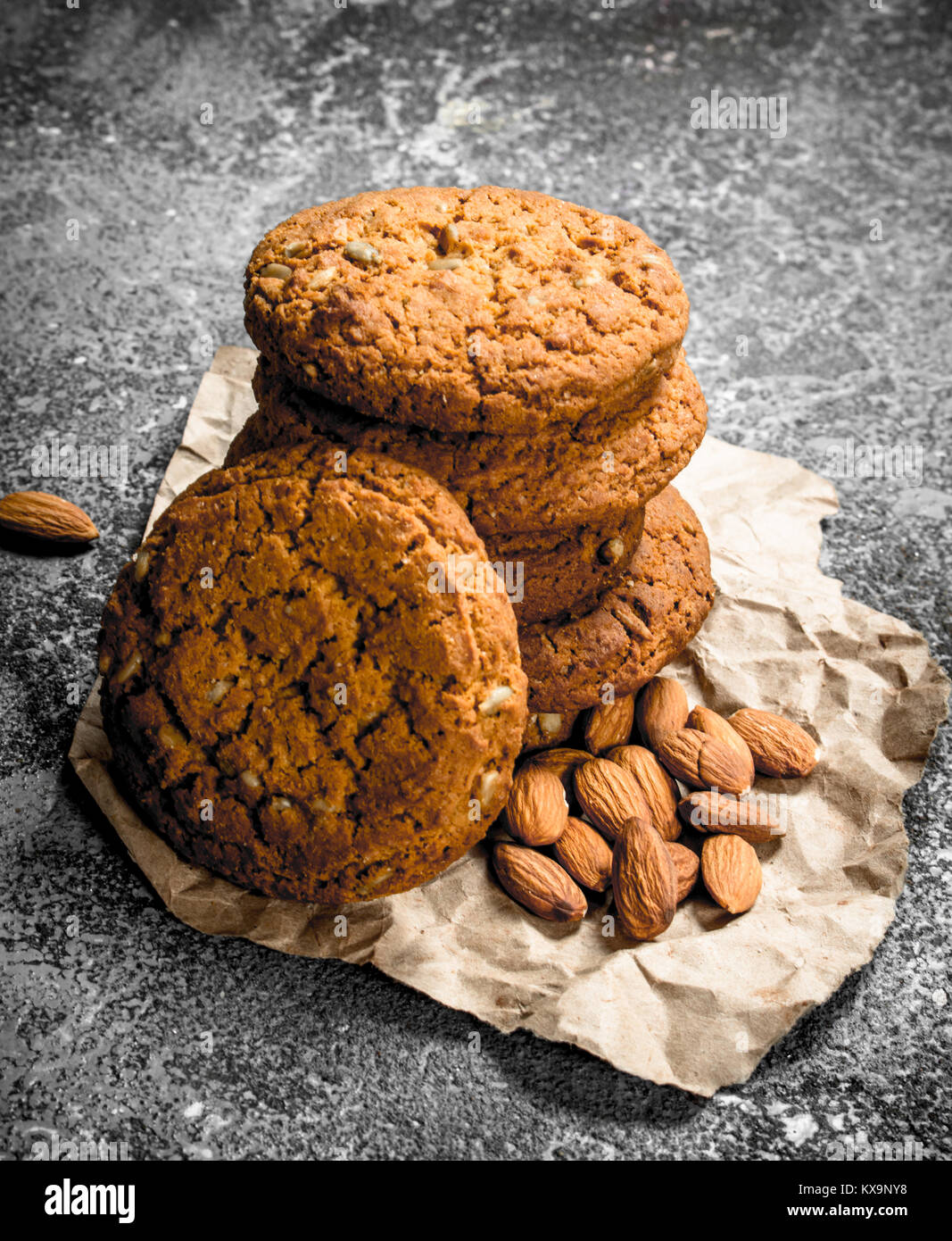 Oatmeal cookies with almonds. On a rustic background Stock Photo - Alamy
