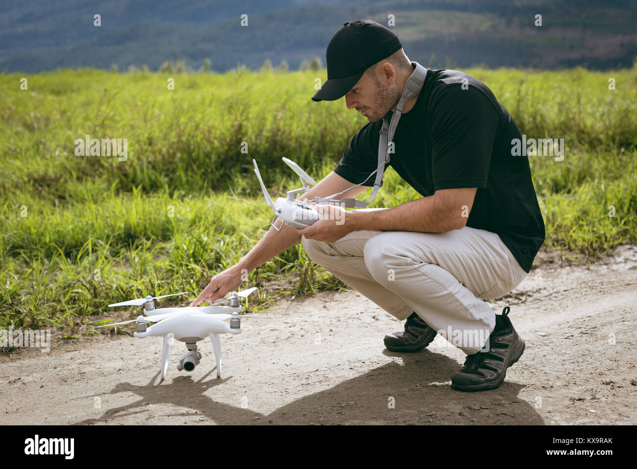Man checking drone before take off Stock Photo - Alamy