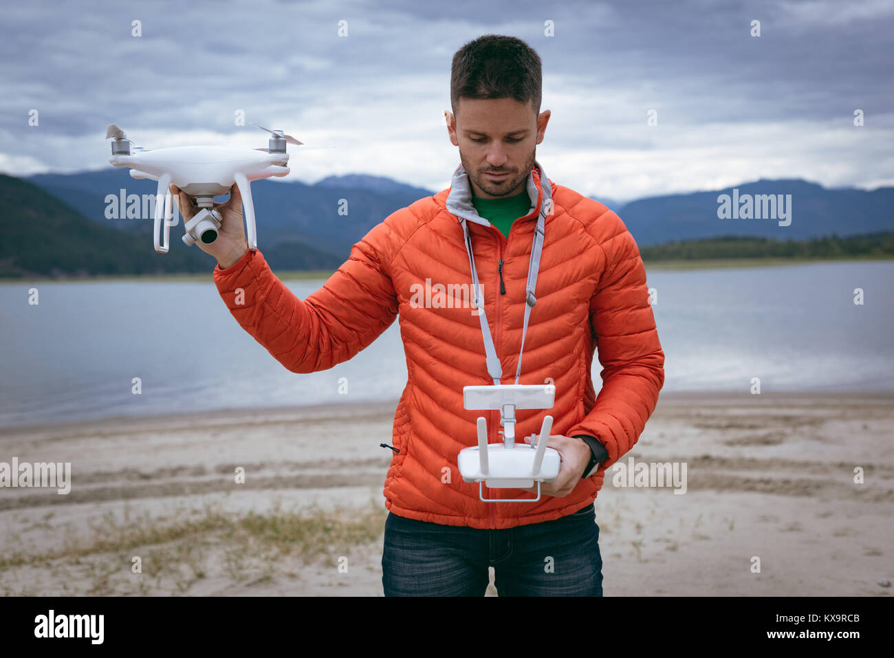 Man holding drone and remote control Stock Photo - Alamy