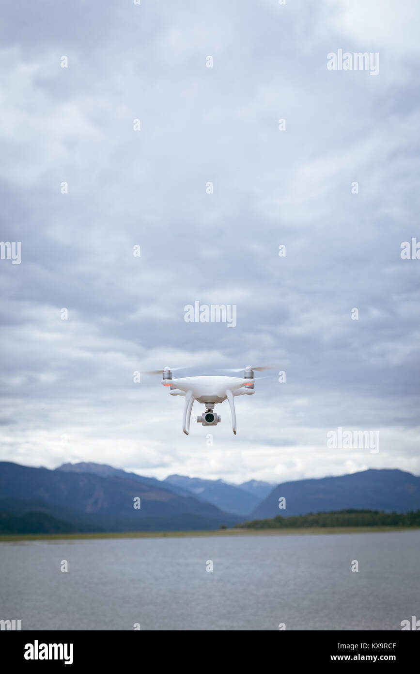 Drone flying over a river Stock Photo - Alamy