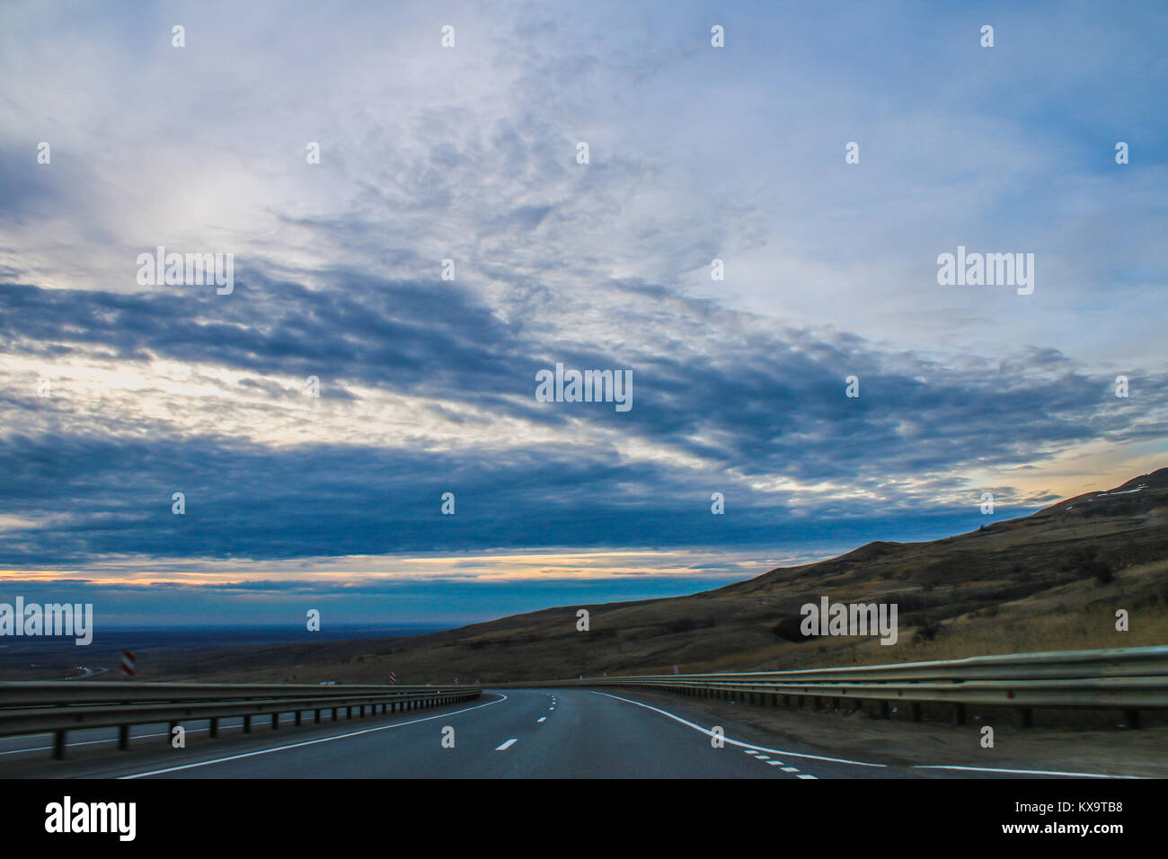 The road in the evening with the setting sun Stock Photo - Alamy