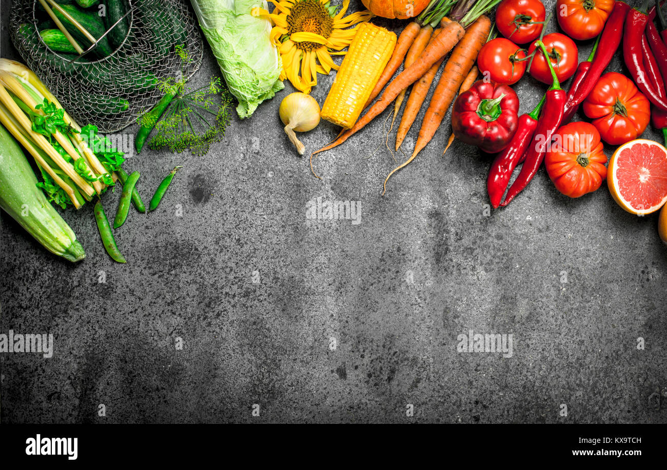 Organic food. Fresh vegetables and fruits. On a rustic background Stock ...