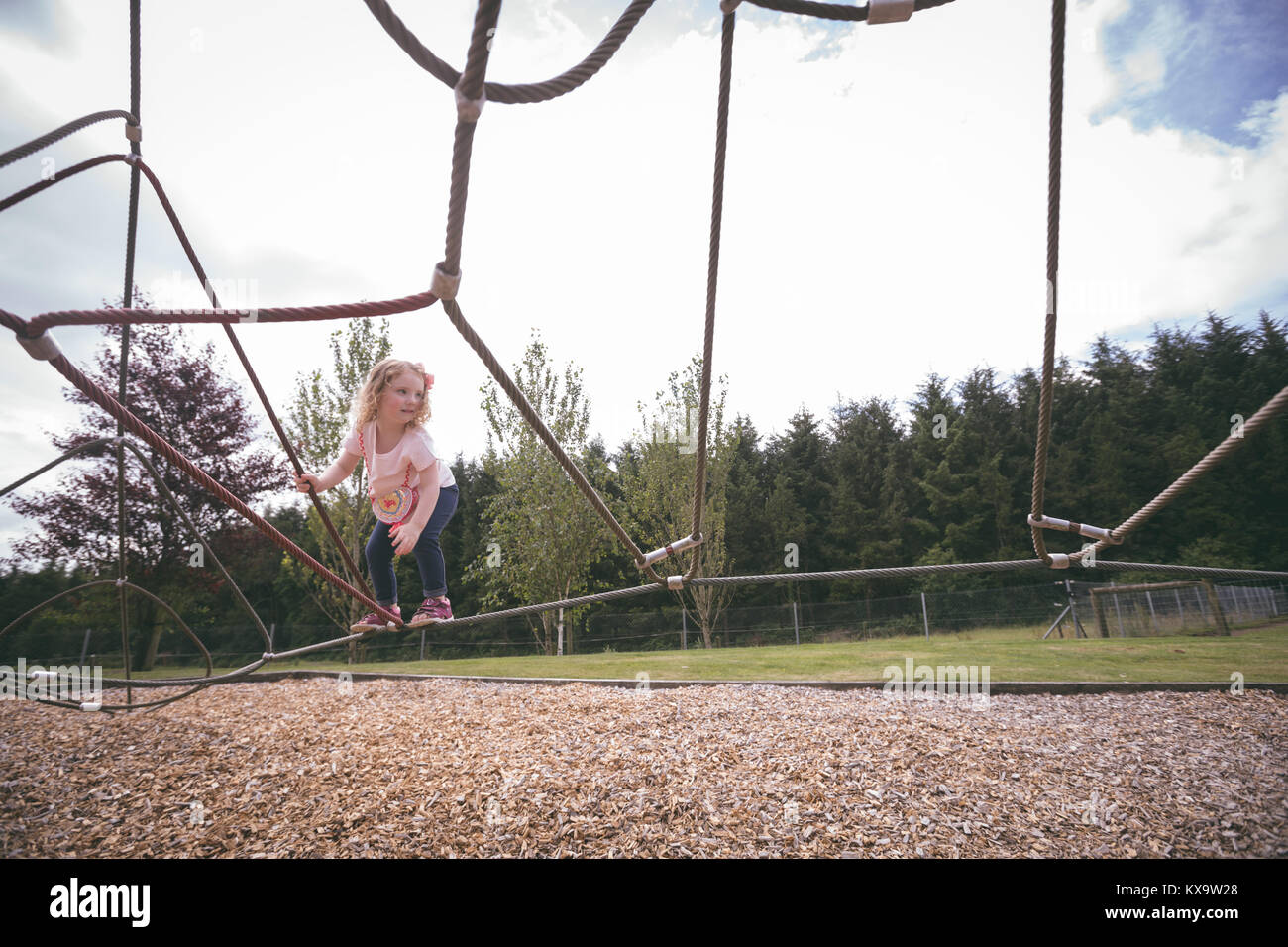 Girl climbing rope hi-res stock photography and images - Alamy