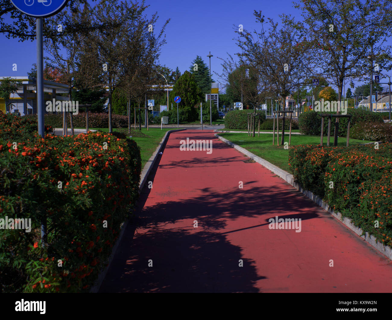 Red bicycle lane in the city in Italy, security for cyclists Stock ...
