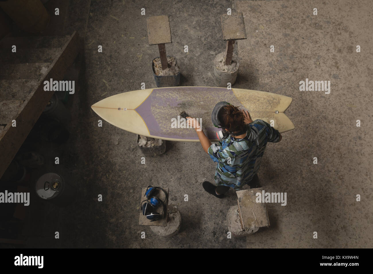 Male worker making surfboard Stock Photo - Alamy