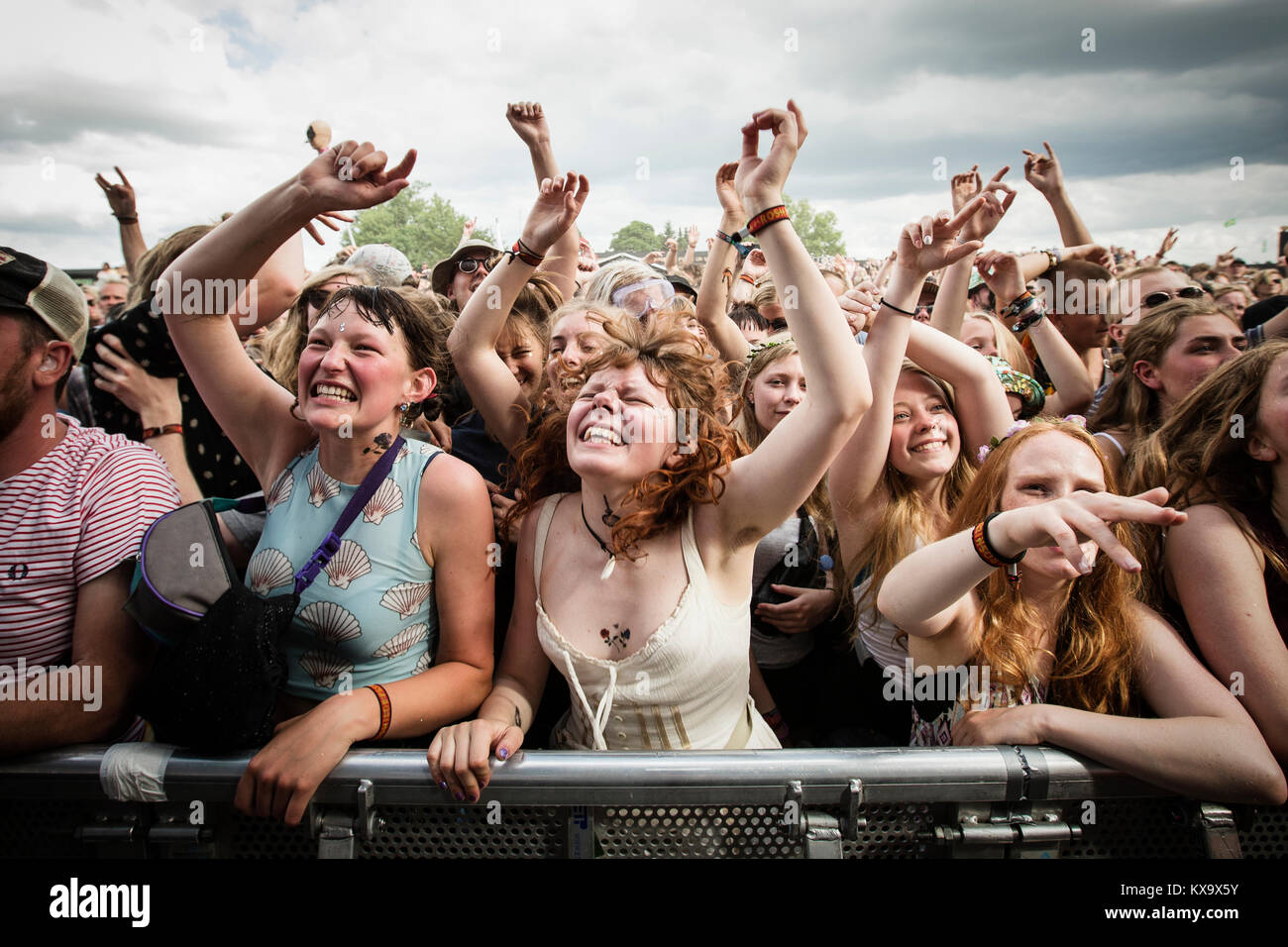 Energetic music fans attend a live concert with the Icelandic female ...