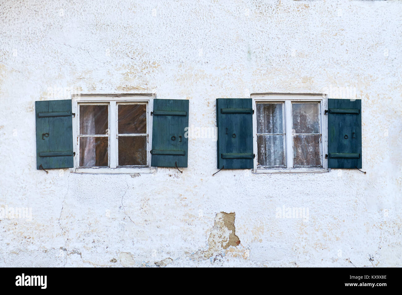 Old rustic windows with wooden shutters on white house Stock Photo - Alamy