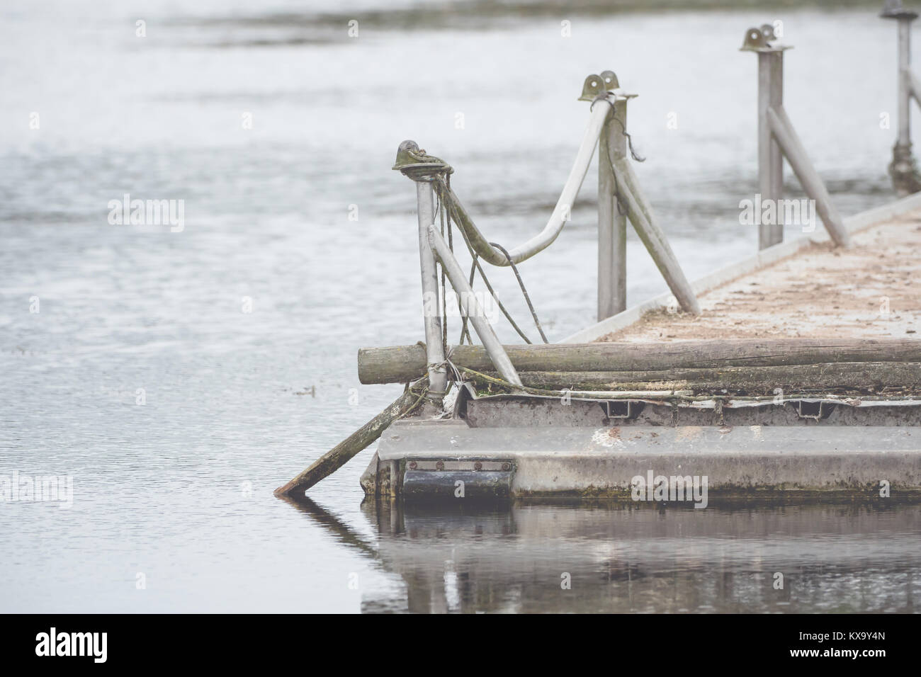 A boat dock with device and net for fishing Stock Photo - Alamy